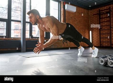 sportsman doing clapping push ups exercise at gym sport club explosive