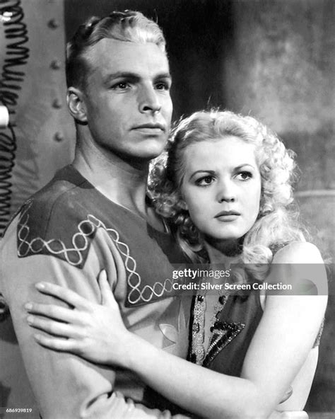Actors Buster Crabbe As Flash Gordon And Jean Rogers As Dale Arden In