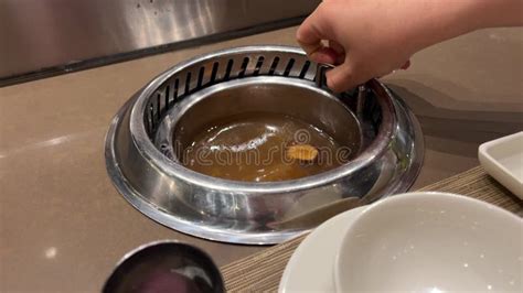 Preparing A Mushroom Dish Enoki Mushrooms Are Boiled In A Pan Enoki