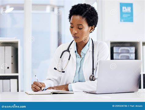 Taking Notes To Better Her Ability An Attractive Young Female Doctor