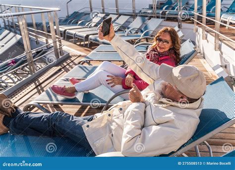 Beautiful Happy Middle Aged Couple Taking A Selfie With Smartphone On A