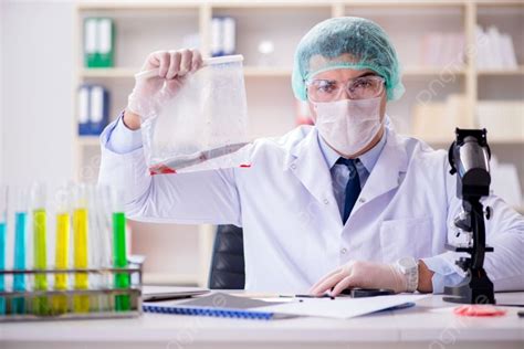 Forensics Investigator Working In Lab On Crime Evidence Photo