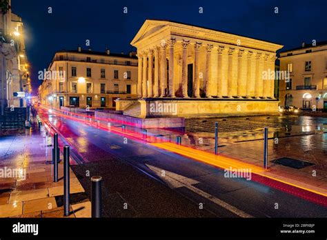 Maison Carree Ancient Roman Temple In Night Lights Nimes France