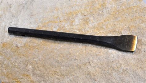 Ancient Chisel And Hammer