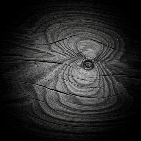 Circular Wood Grain Pattern Centered Around A Prominent Knot In A Piece