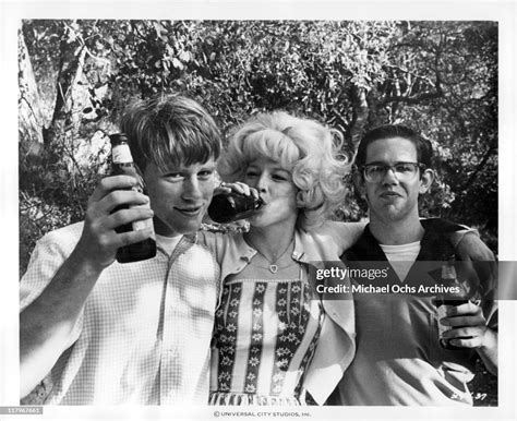 Candy Clark Drinking Beer And Posing With Ron Howard And Charles