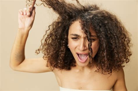Premium Photo Portrait Of Young Woman With Eyes Closed Against Wall