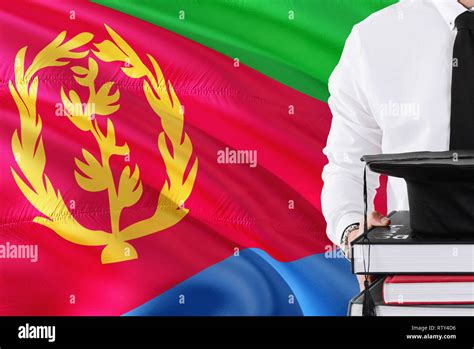 Successful Eritrean Babe Education Concept Holding Books And Graduation Cap Over Eritrea