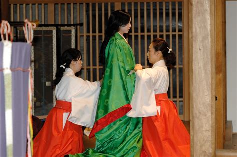 A Woman Being Dressed In Junihitoe