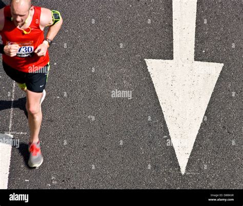 Male London 2013 Marathon Runner Athlete Competitor Passing Arrow Sign