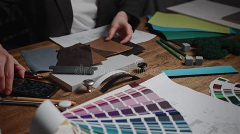 An Unrecognizable Female Architect Works In A Design Studio Developing