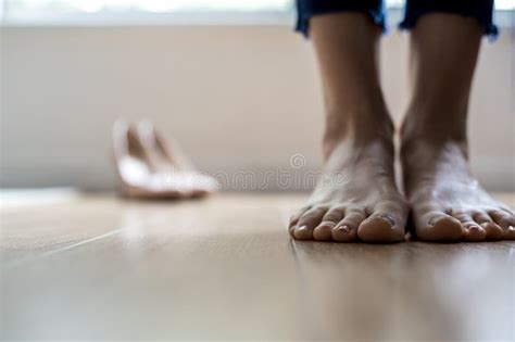 Barefoot Woman Focus On Feet And Shoes In Blur Symbolic Image Resting