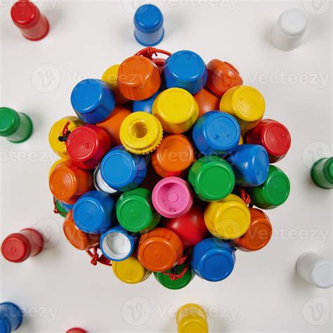 A Collection Of Assorted Colored Plastic Bottle Tops And Containers