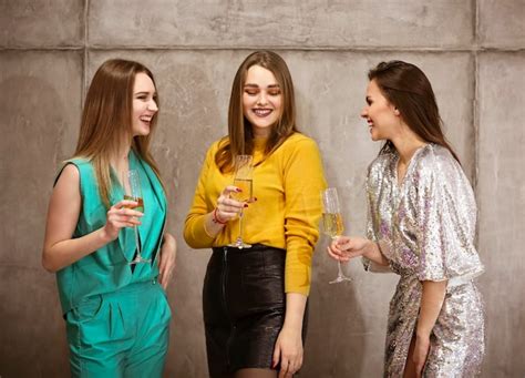 Young Woman Standing Against Glass Wall Premium Photo