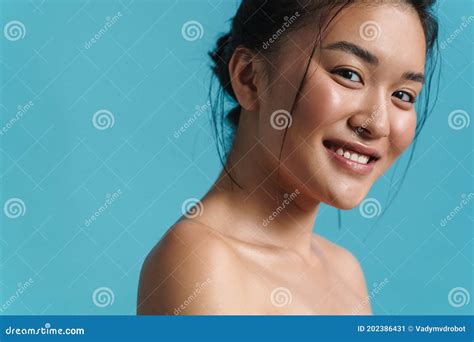 Beauty Portrait Of A Smiling Topless Young Asian Woman Stock Image
