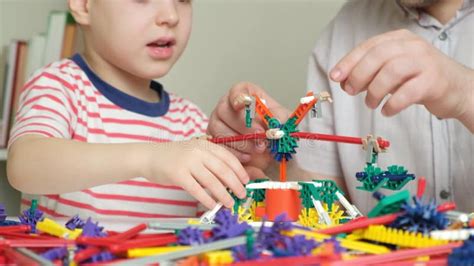 Dad And Son Build Figures From The Constructor Spending Time Together
