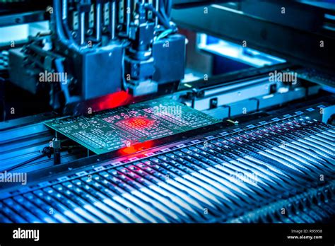 Electronic Circuit Under Surface Mounting Machine Shot In Red And Blue Tints Surface Mount