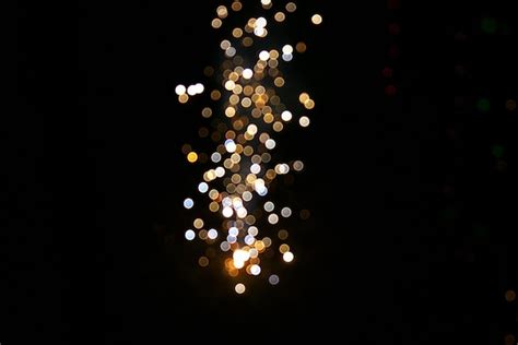 Premium Photo Abstract Illuminated Lights Against Black Background
