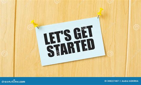 Let S Get Started Sign Written On Sticky Note Pinned On Wooden Wall