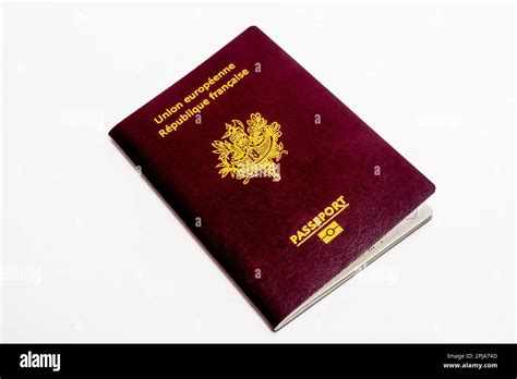 French Passport Resting On A White Surface Highlighting Its Cover