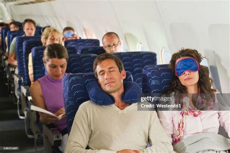 Germany Munich Bavaria Passengers Sleeping In Economy Class Airliner