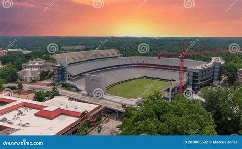 Aerial Shot Of Sanford Stadium Surrounded By Buildings A Tower Crane