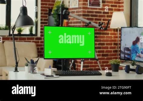 Greenscreen Display On Computer With Empty Desk In Living Room Workspace With Chroma Key Blank