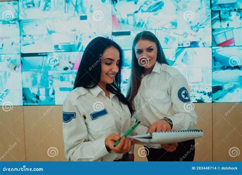 Group Portrait Of Female Security Operator While Working In A Data System Control Room Offices