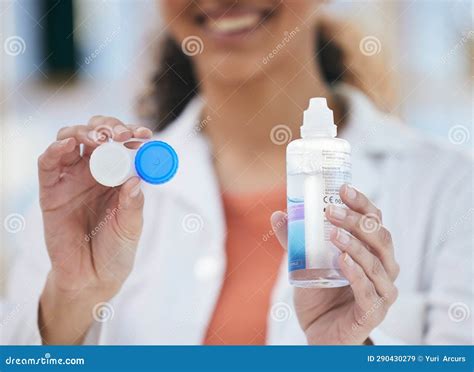 Optometry Contact Lens And Solution In Hands Container And Healthcare