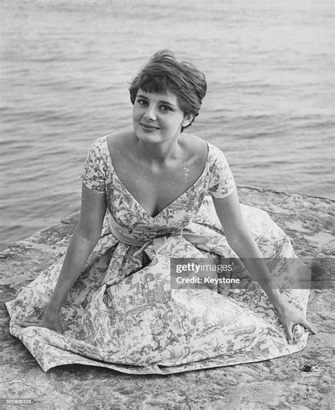 Portrait Of Italian Actress Rossana Podesta Sitting On A Rock Outcrop