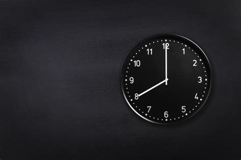 Premium Photo Wall Clock Showing Eight Oclock On Black Chalkboard Background Office Clock