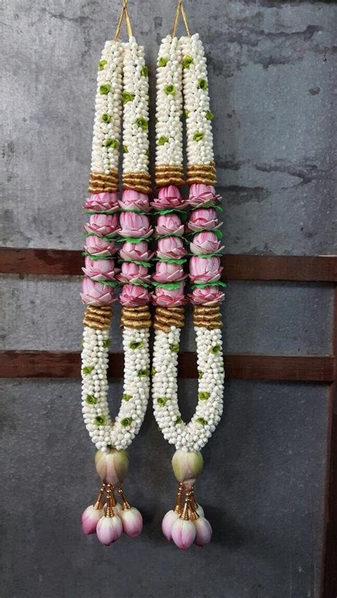 White And Pink Jasmine Embedded Garland With Lotus At ₹ 4999pair In