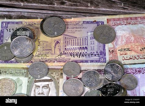 Saudi Arabia Riyals Money Banknote Bills And Coins Of Different Eras From The Kingdom Of Saudi