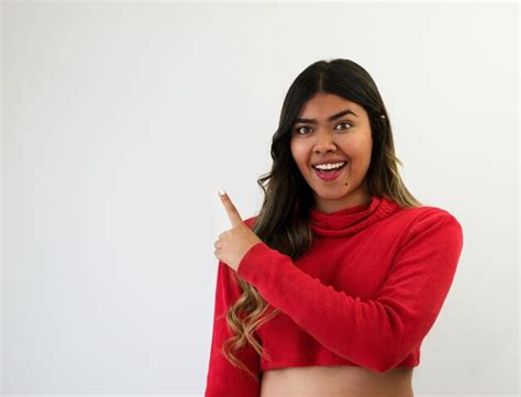 Premium Photo A Smiling Surprise Brunette Isolated Woman In A Red