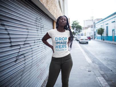 Placeit Young Woman Wearing A T Shirt Template While Posing In The Street