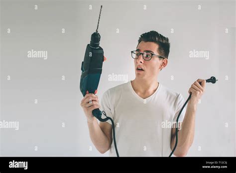Funny Portrait Upset Craftsmen Nerd Is Wearing Glasses Does Not Know How To Use A Drill Stock