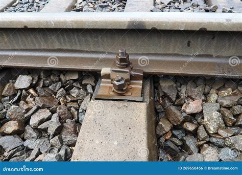 Railways Metal Steel Rails And Wooden Sleepers Rivets And Fasteners On The Railroad Stony