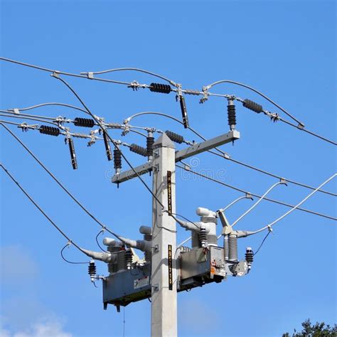 Low Angle Shot Of A Power Transformer And Electrical Wires On A Metal