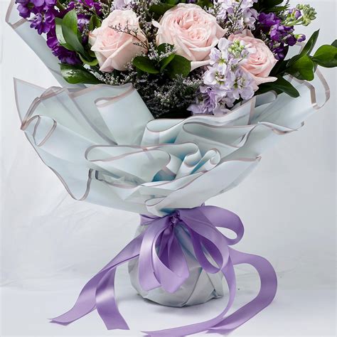 Online Elegant Mixed Flowers Wrapped Bouquet T Delivery In Singapore