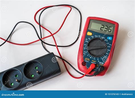 Measurement Of Voltage In Electrical Socket Digital Multimeter Stock