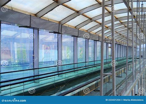 Escalator In The Underground Passage Ascending And Descending On The