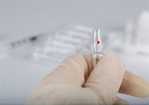 Glass Ampule With Medication In The Hand Of Medical Sister Stock Image