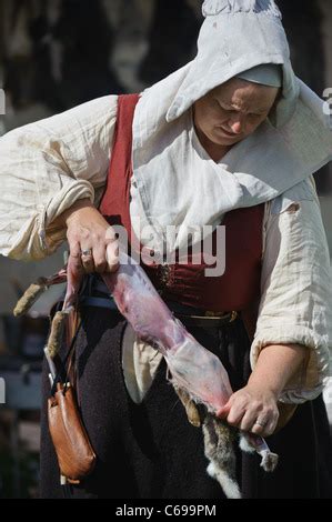 A Woman Skinning A Rabbit At Scotlands Festival Of History In Lanark
