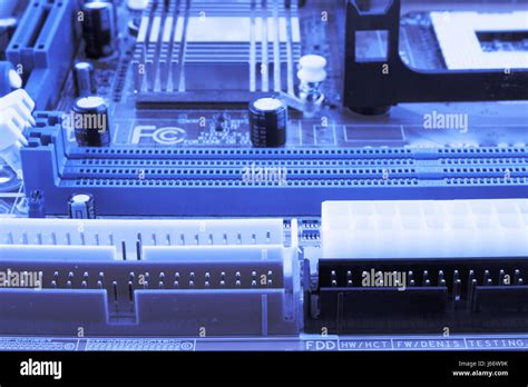 Integrated Semiconductor Microchip Microprocessor On Blue Circuit Board Representative Of The