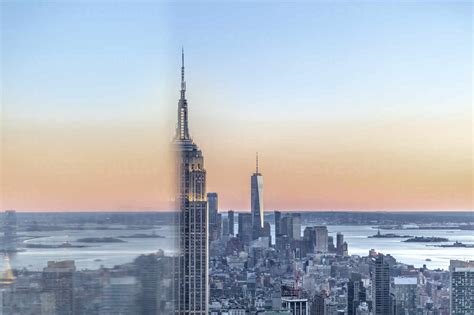 Skyline At Sunset With Empire State Building In Foreground And One