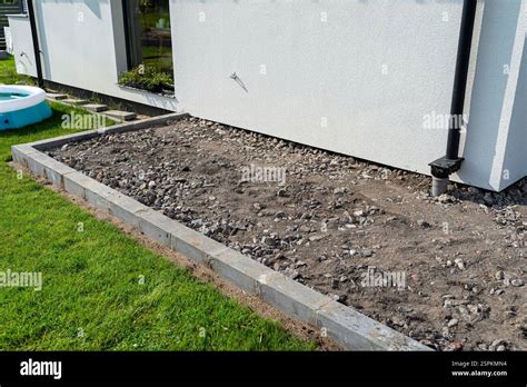 Compacting Rubble On A Terrace Under Construction Using A Gasoline