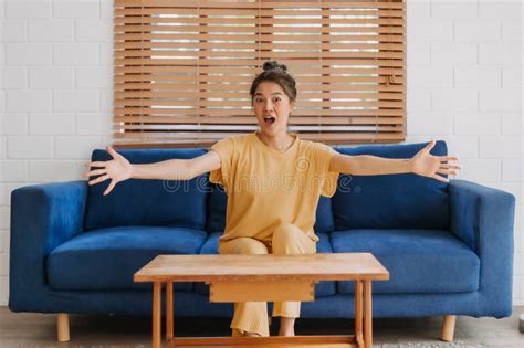Wow And Surprised Face Of Wife Woman Sits On The Sofa In The House Stock Image Image Of