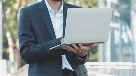 businessman using tablet analyzing sales data and economic growth graph