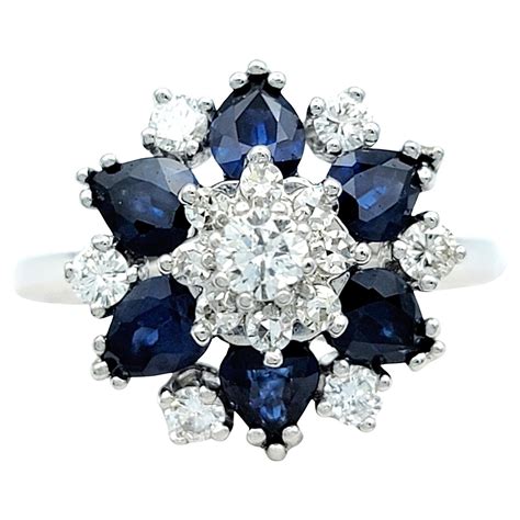 Natural Blue Sapphire And Diamond Flower Bypass Ring Set In 18 Karat White Gold For Sale At 1stdibs