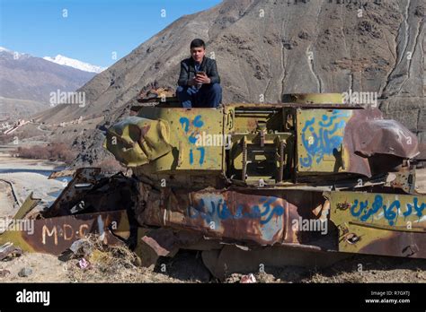 Young Men Besides Tanks Left After The Soviet Afghan War Panjshir Valley Panjshir Province